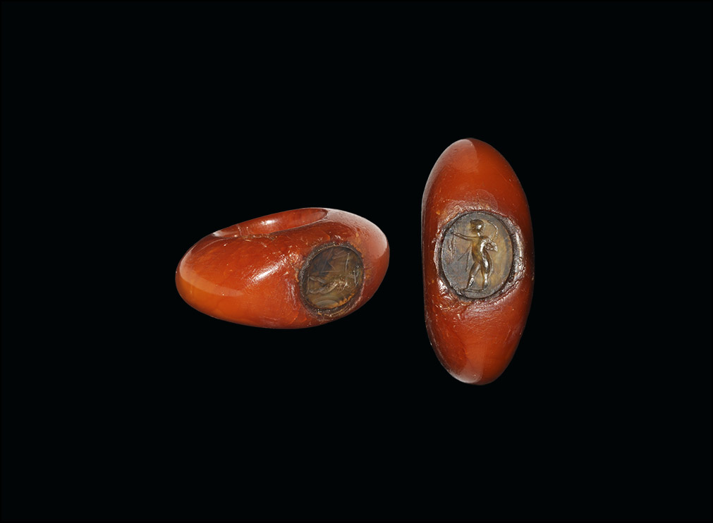 A Roman amber intaglio Legionnaires - auctions & price archive